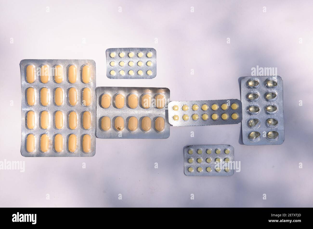 Yellow Color Capsule or Pills Medicine on white background in natural ...