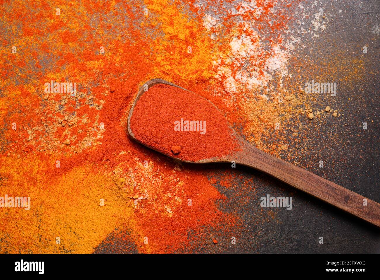 Indian woman hand powdering Indian spices Red chilly , chili paprika ...
