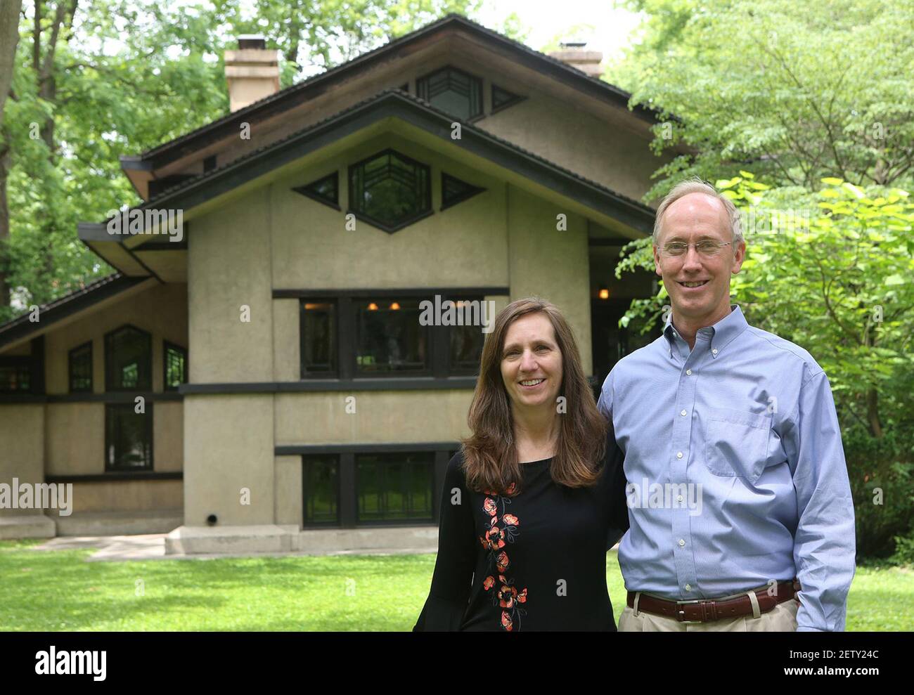 Mary and Rich Berry pose outside of their home in Edwardsville, Ill ...