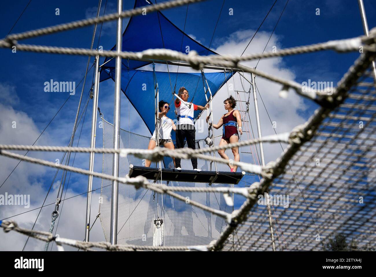 Richard Chin gets some help from coach Katrina Nord, left, on his first ...