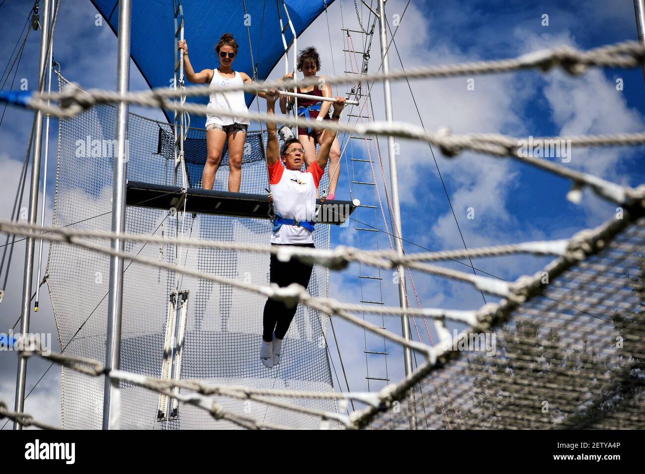 Richard Chin gets some help from coach Katrina Nord, left, on his first ...