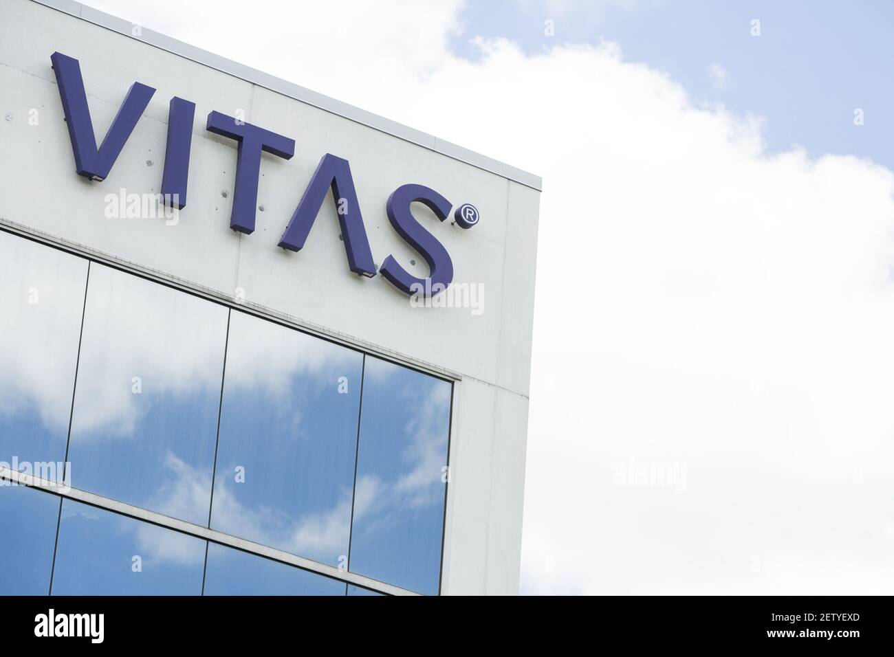 A logo sign outside of a facility occupied by VITAS Healthcare in ...