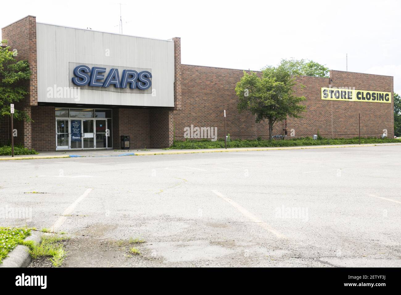 'Store Closing' banners outside of a Sears retail store location in ...