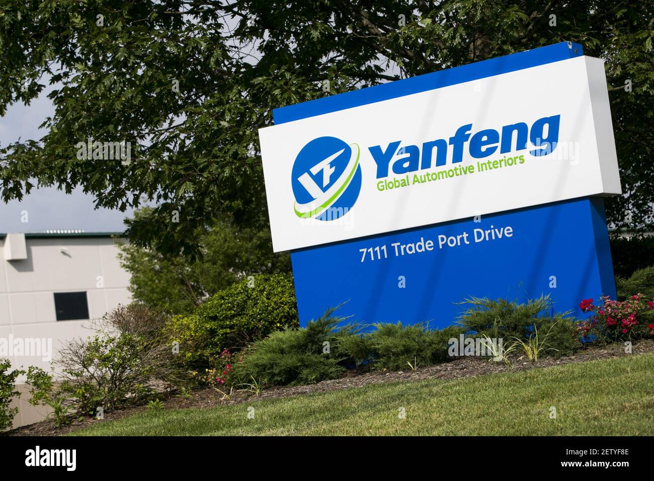 A logo sign outside of a facility occupied by Yanfeng Automotive ...