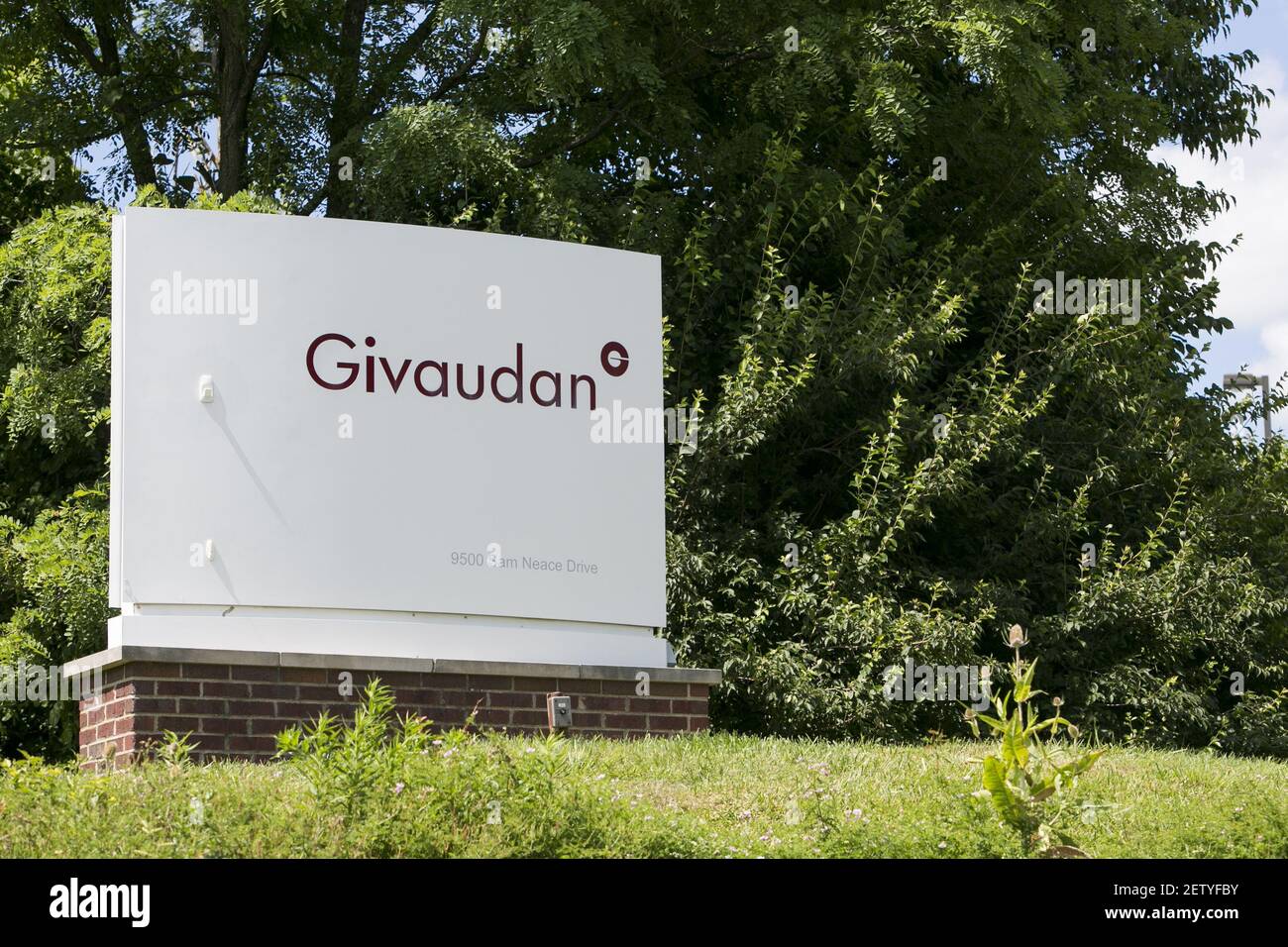 A logo sign outside of a facility occupied by Givaudan in Florence ...