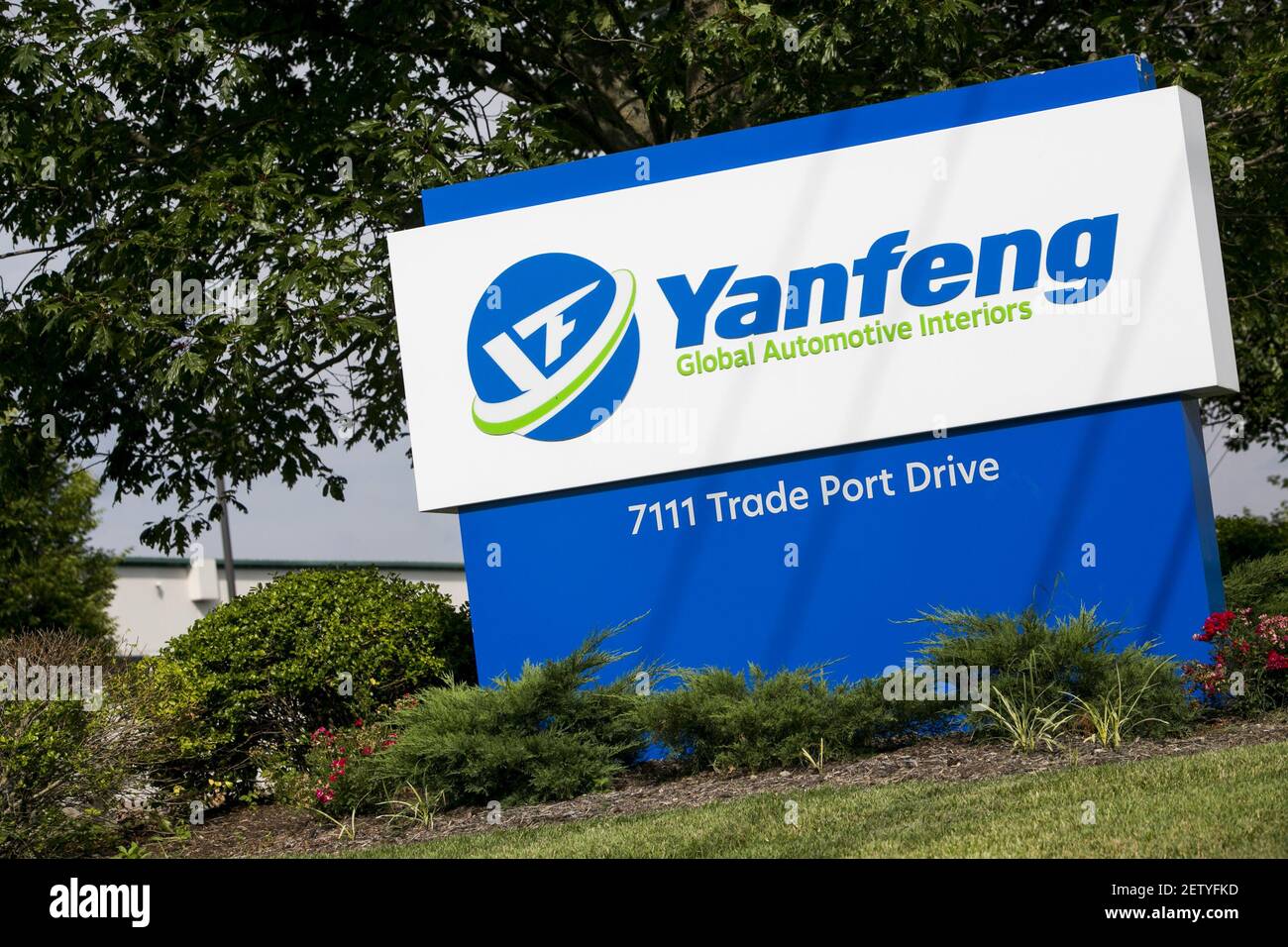 A logo sign outside of a facility occupied by Yanfeng Automotive ...