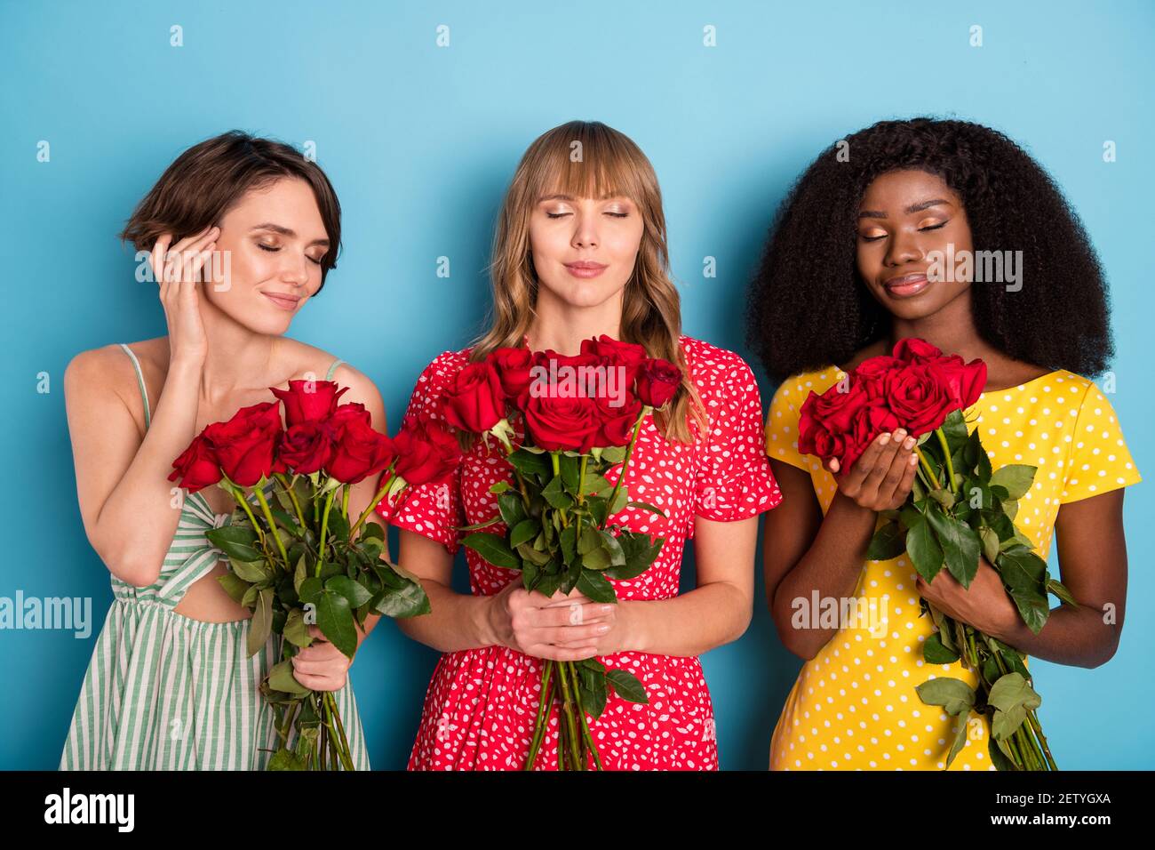 Photo of young attractive tender girls hold bouquet roses holiday ...