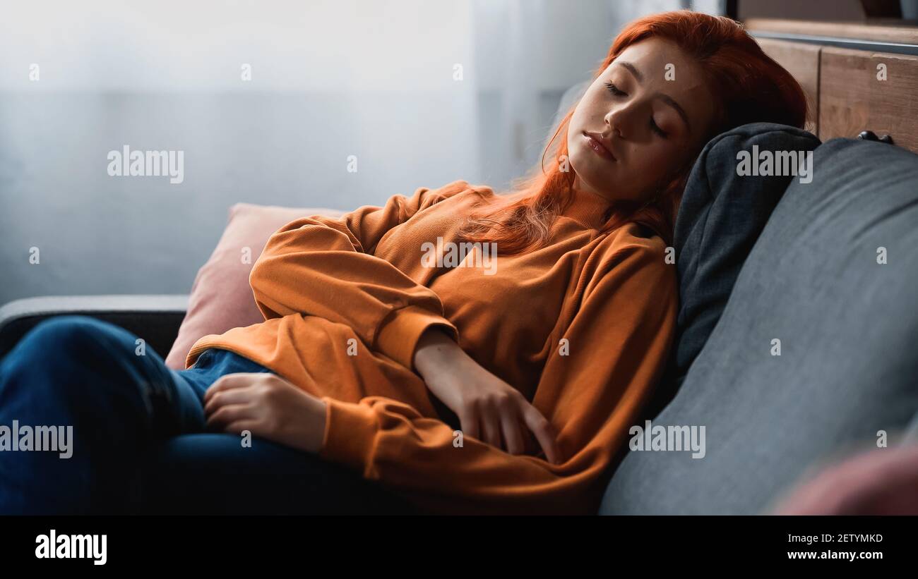 Girl sleeping on couch hi-res stock photography and images - Alamy