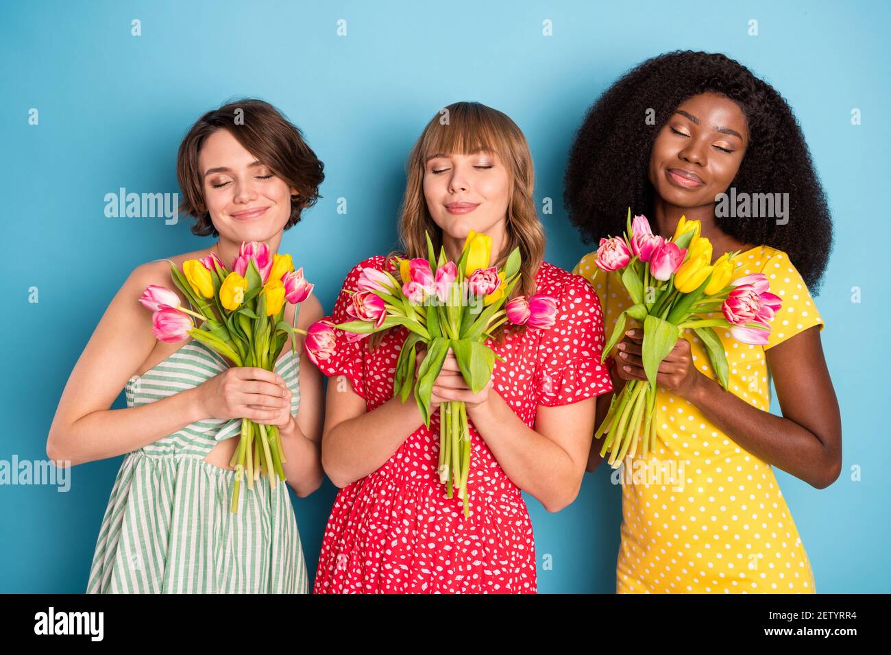 Photo of three young girls happy positive smile enjoy smell aroma ...