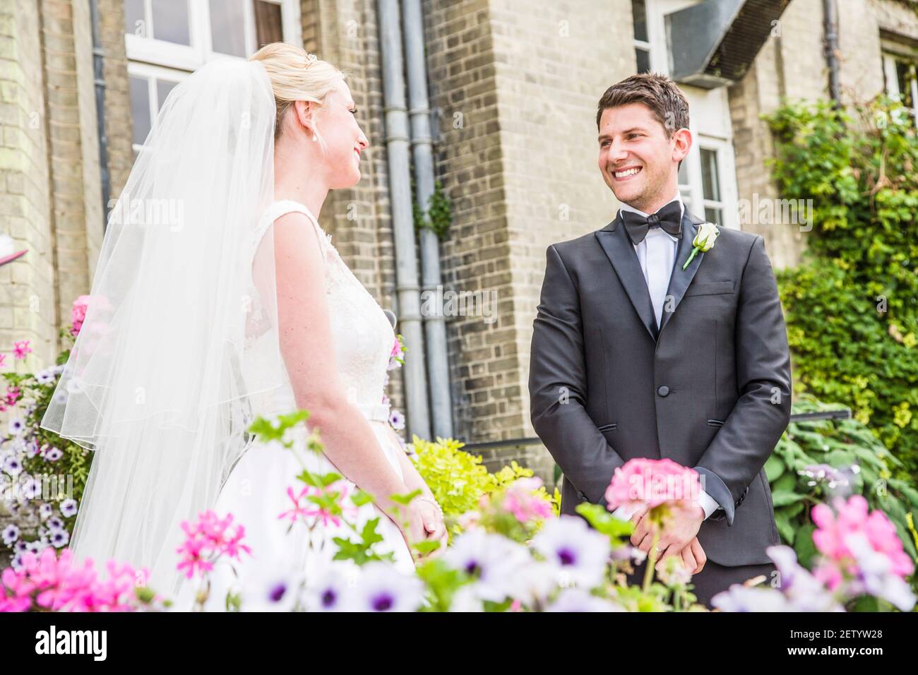 wedding couple smiling at each other Stock Photo - Alamy