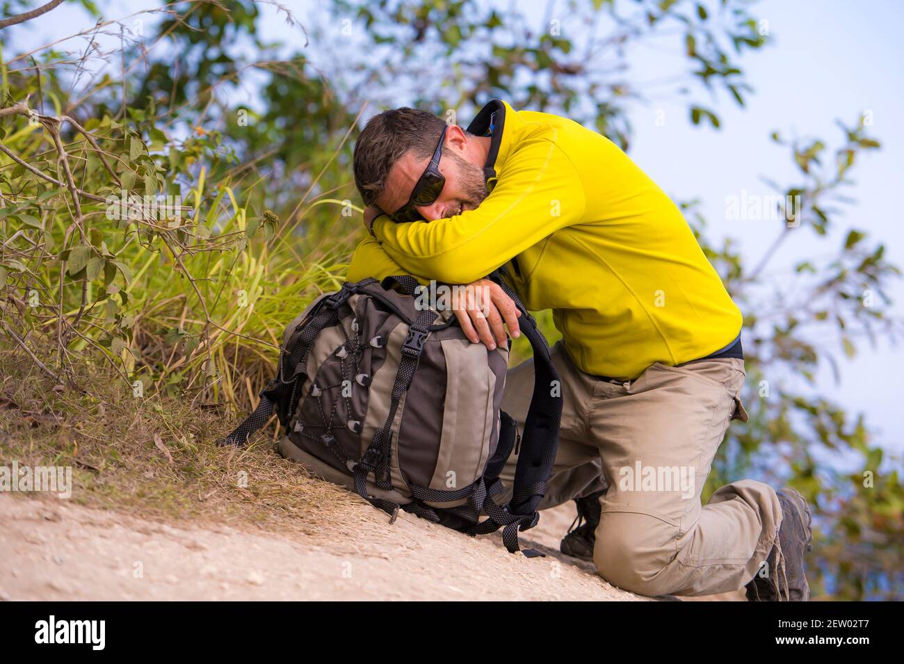 weekend outdoors - young happy and attractive hiker man with backpack ...