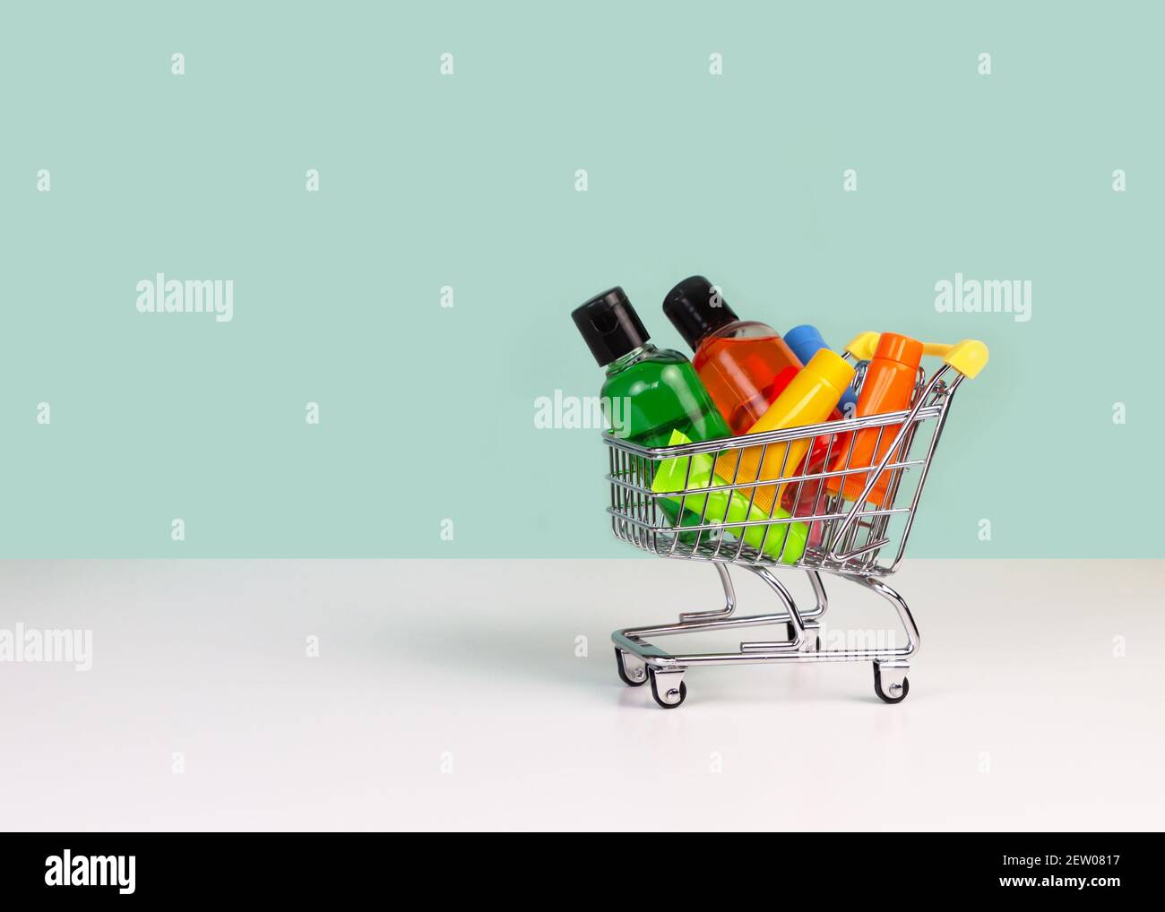 Miniature shopping trolley cart with a set of cosmetics. World consumer ...