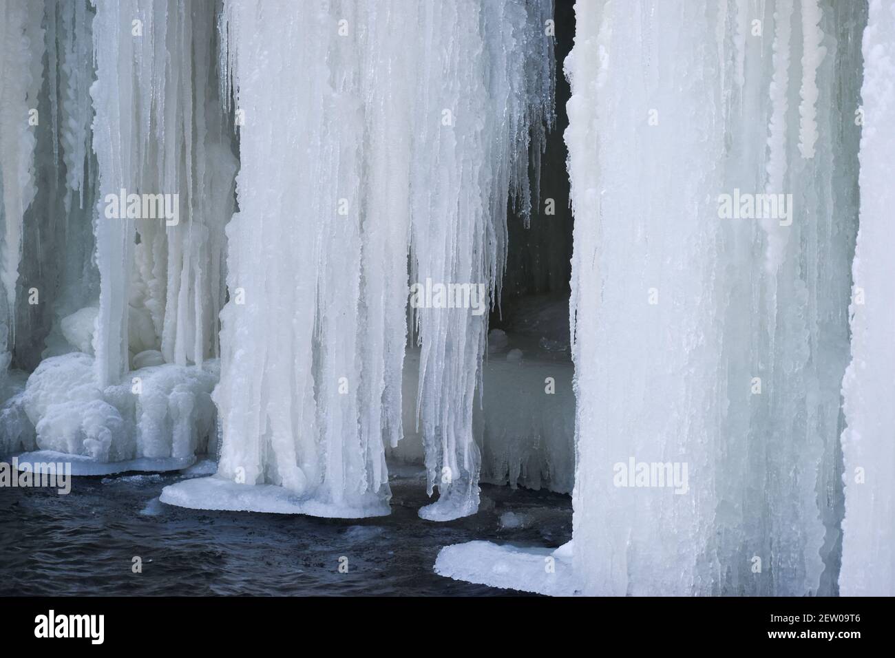 Large icicles around waterfalls Stock Photo - Alamy