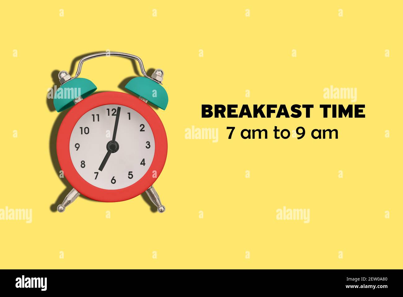 Time for breakfast. The alarm clock shows 7 o'clock in the morning. Old ...