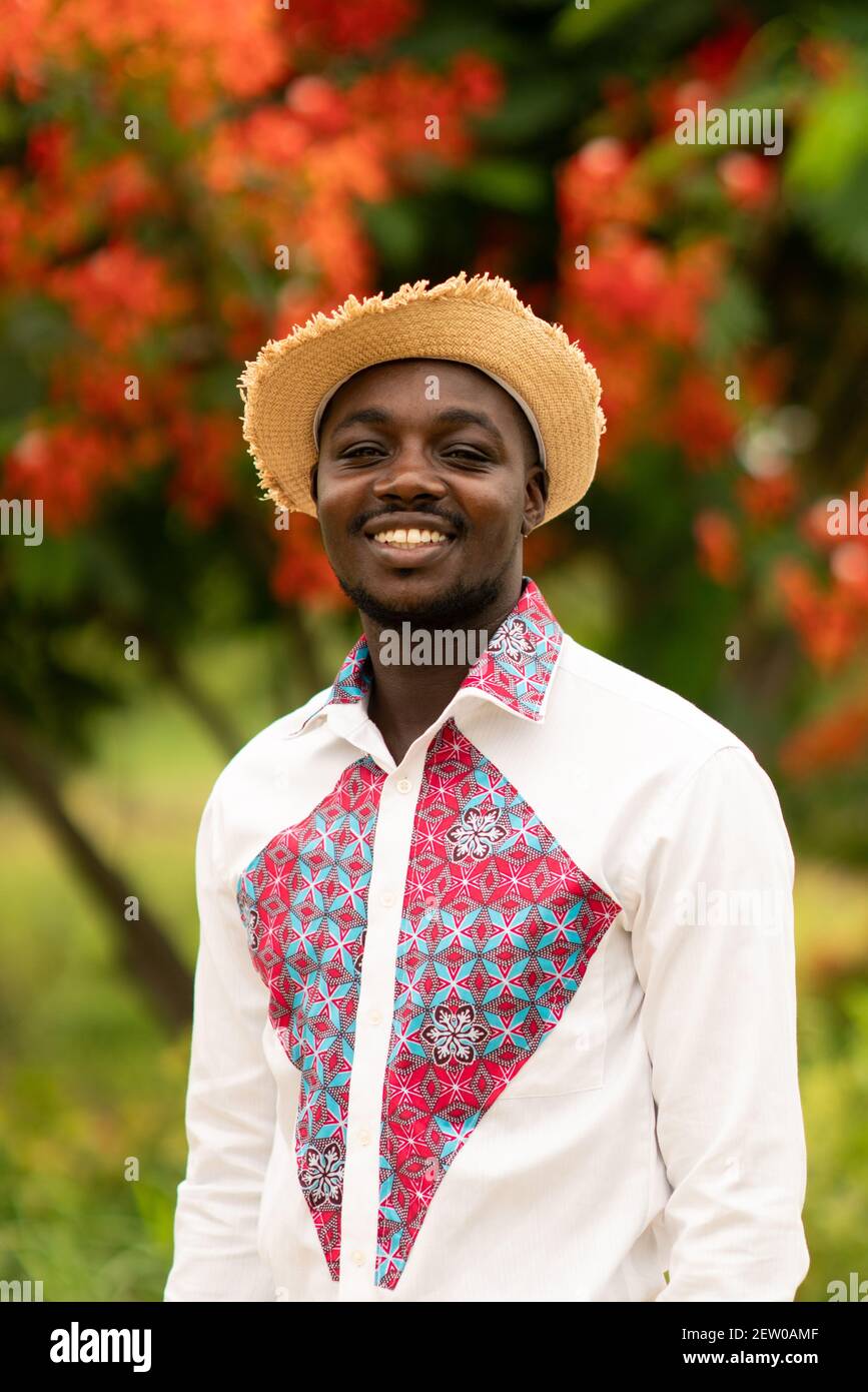 African man wearing native cloth traditional colorful with smile and ...