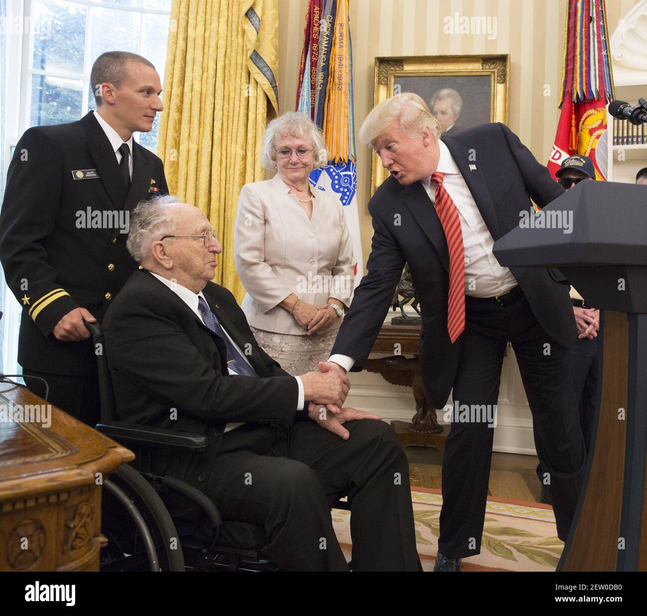U.S. President Donald J. Trump shakes the hand of Lauren Bruner while ...