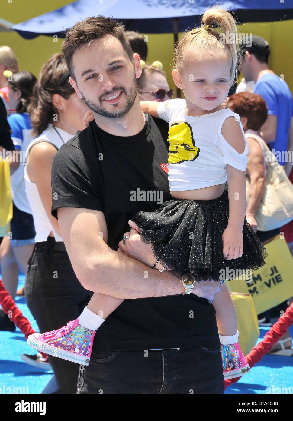 (L-R) Matthew Rutler and Summer Rain Rutler arrives at "The Emoji Movie ...