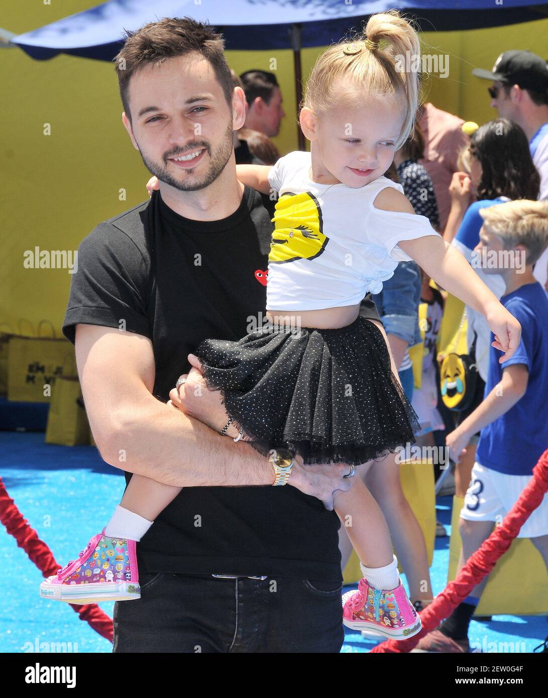(L-R) Matthew Rutler and Summer Rain Rutler arrives at "The Emoji Movie ...
