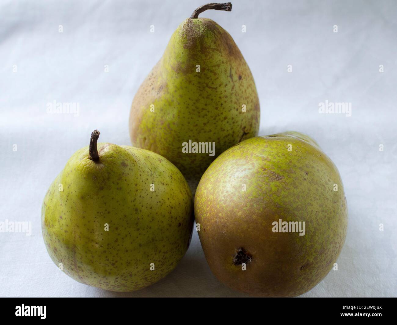Three pears with white background Stock Photo - Alamy