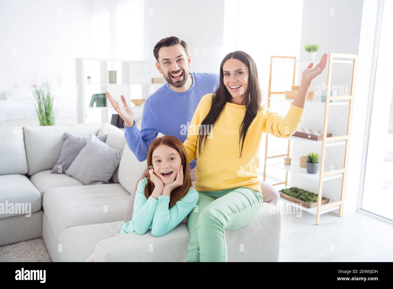 Photo of cheerful family mom dad kid happy positive smile have fun wave ...