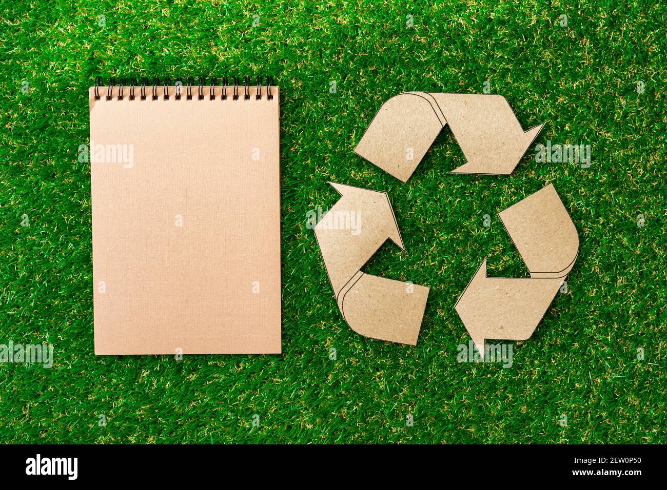 Craft paper on grass, recycling concept, top view Stock Photo - Alamy