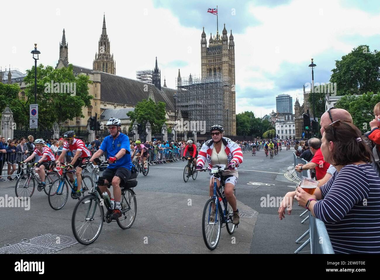 Riders pass the Houses of Parliament in the Prudential Ride London ...