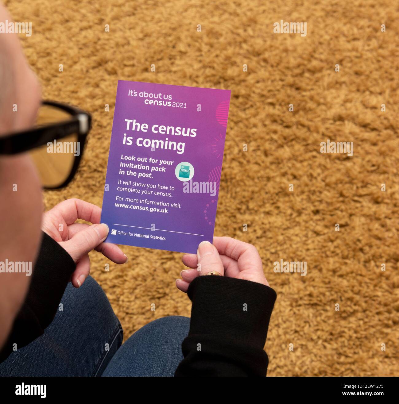 Woman reading a 2021 Census leaflet Stock Photo - Alamy
