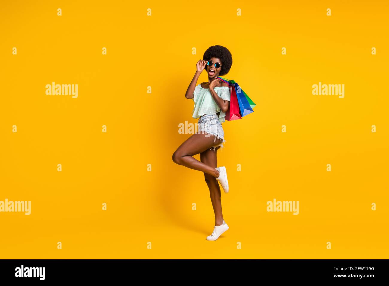 Full length body size photo of black skinned girl holding packages sale ...