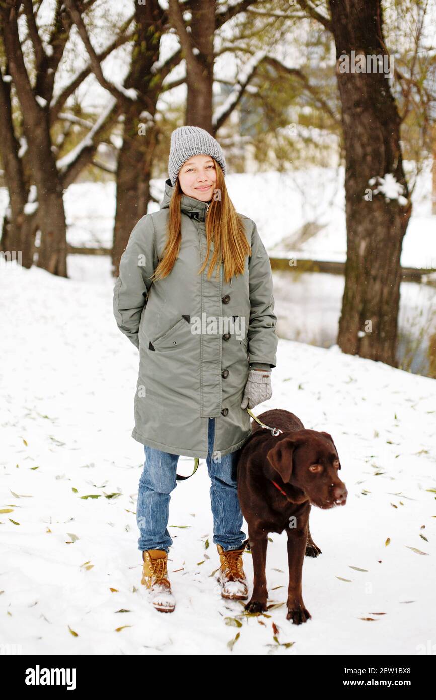Girl walking labrador retriever dog hi-res stock photography and images ...