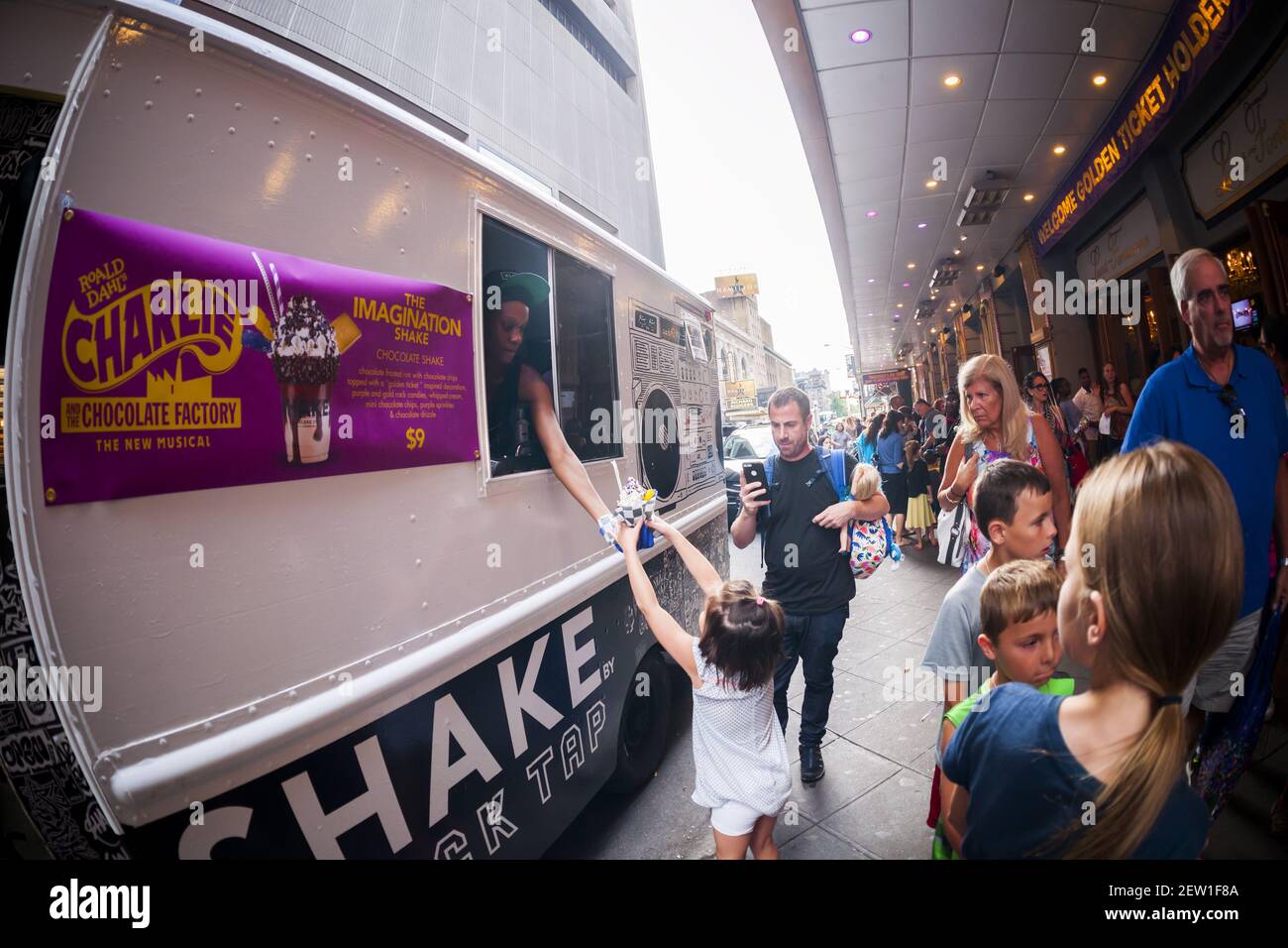 Theatre-goers exiting the Lunt-Fontanne Theatre on Broadway in New York ...