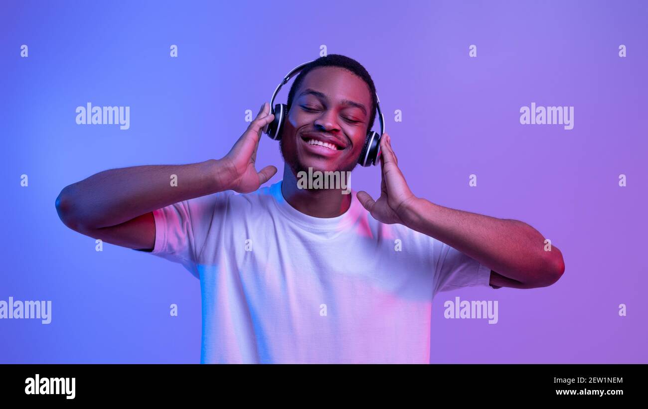 Music Streaming Services. Portraif Of Smiling Black Guy In Wireless ...