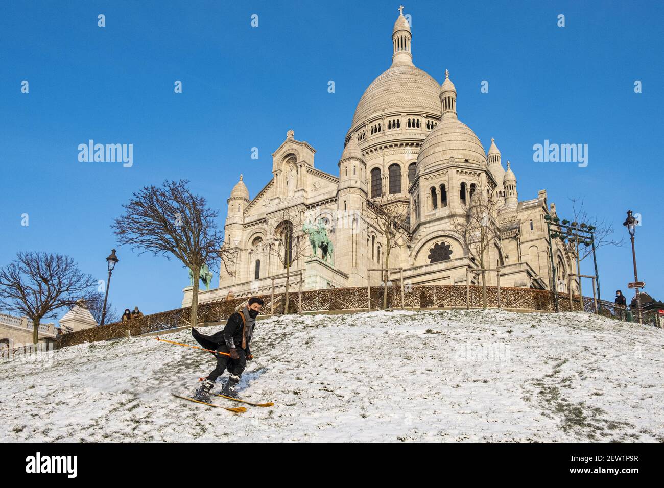 France, Paris, skiing on Montmartre hill in front of the Sacre Coeur ...