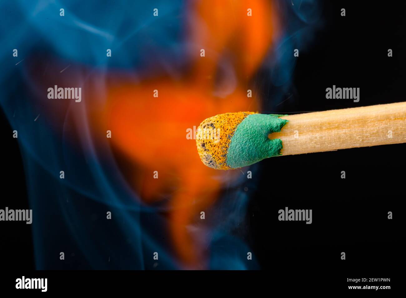 A lighted match very close up on a black background Stock Photo - Alamy