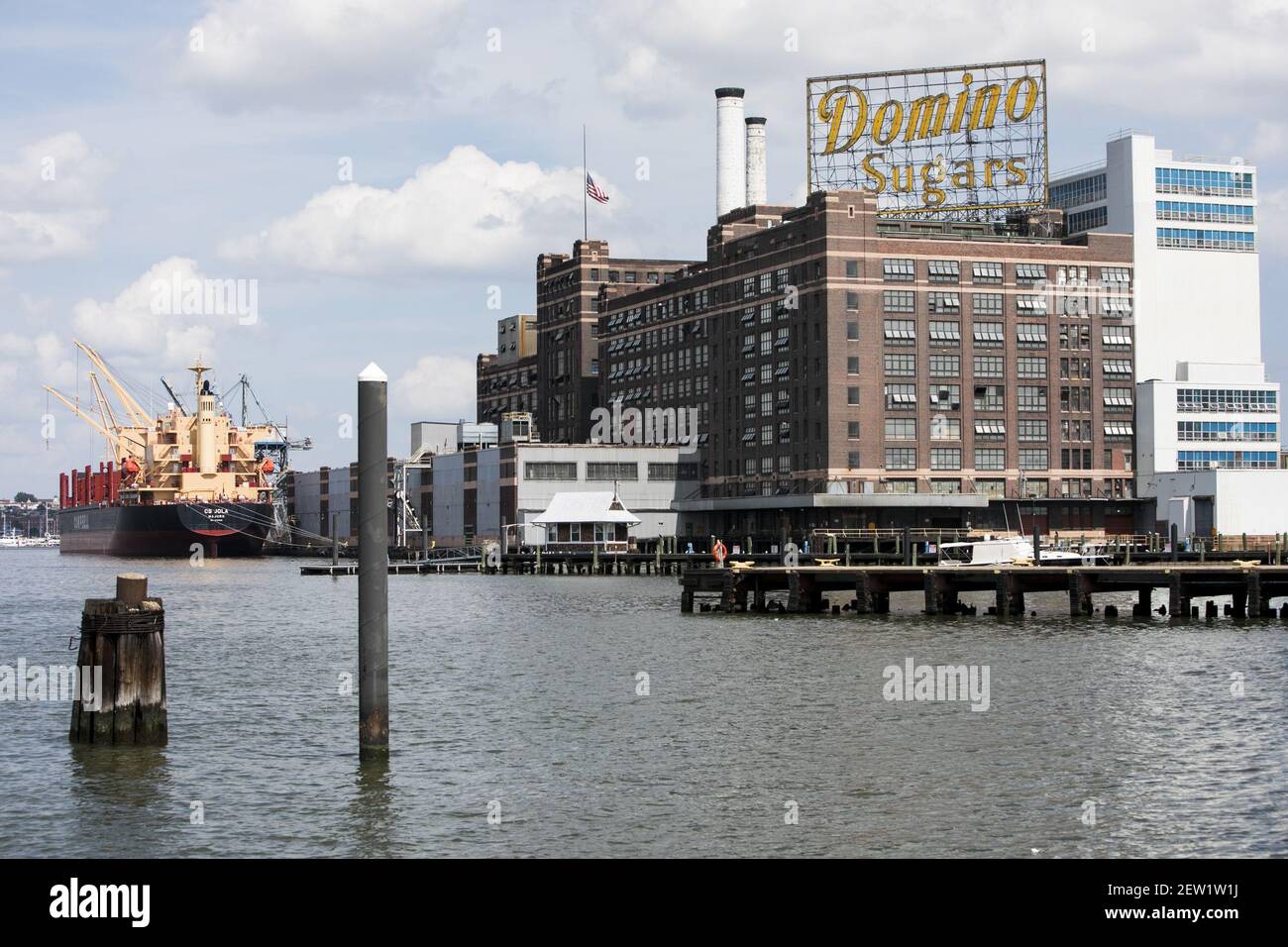 A logo sign outside of a facility occupied by Domino Sugars in ...