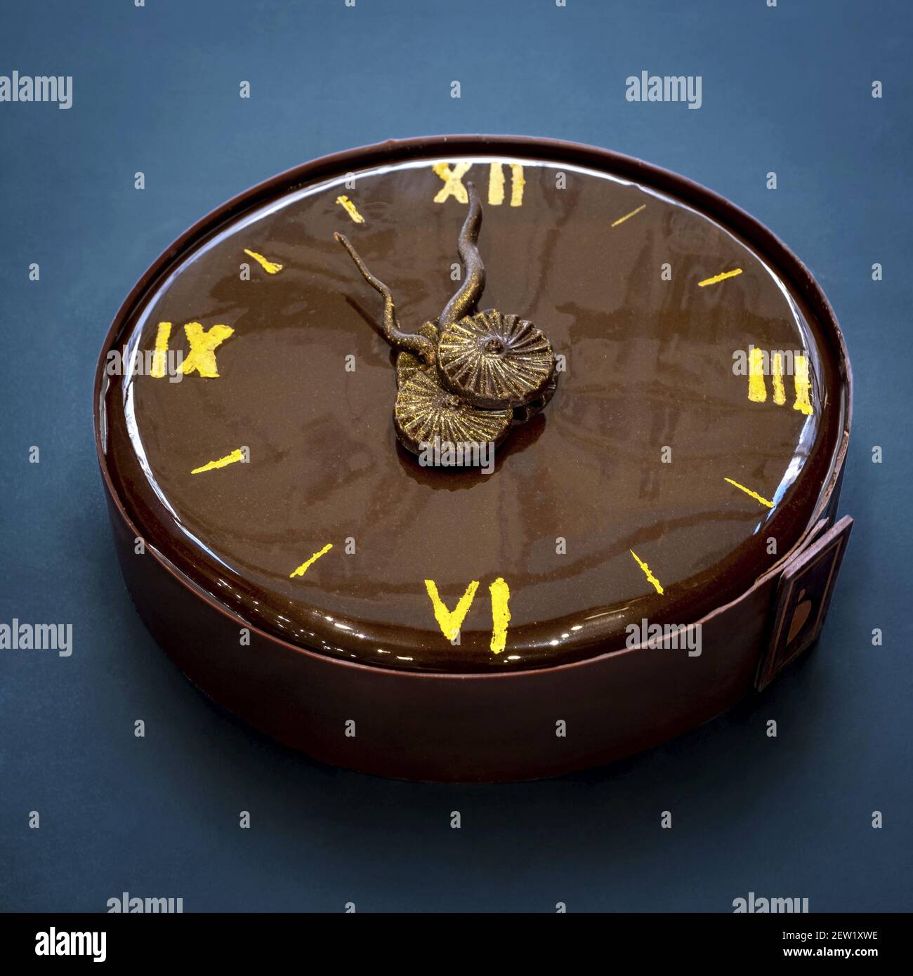 Clock shaped cake, chocolate ganache Stock Photo - Alamy