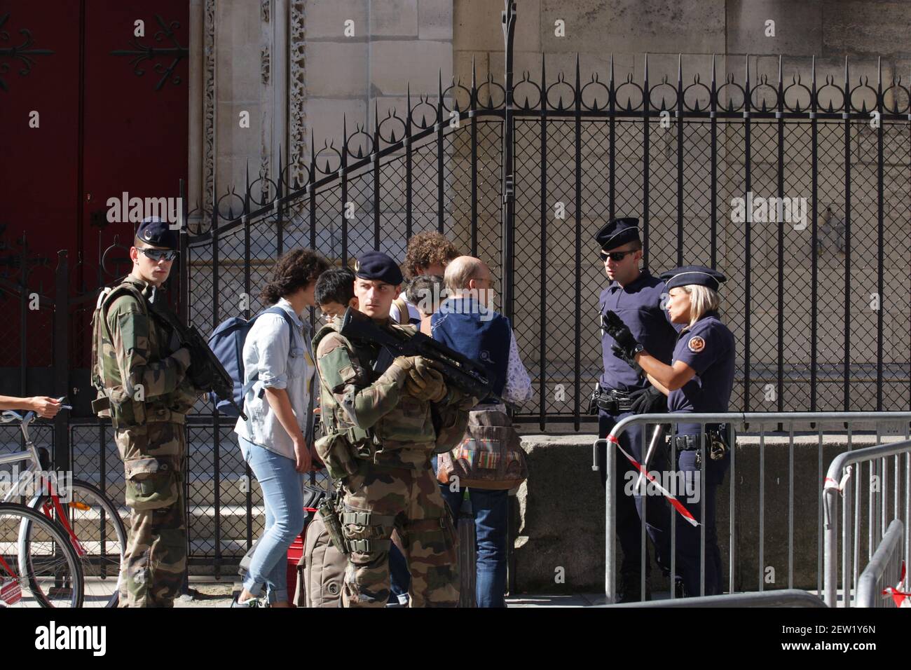 French Army soldiers and police officers patrol the area around of the ...