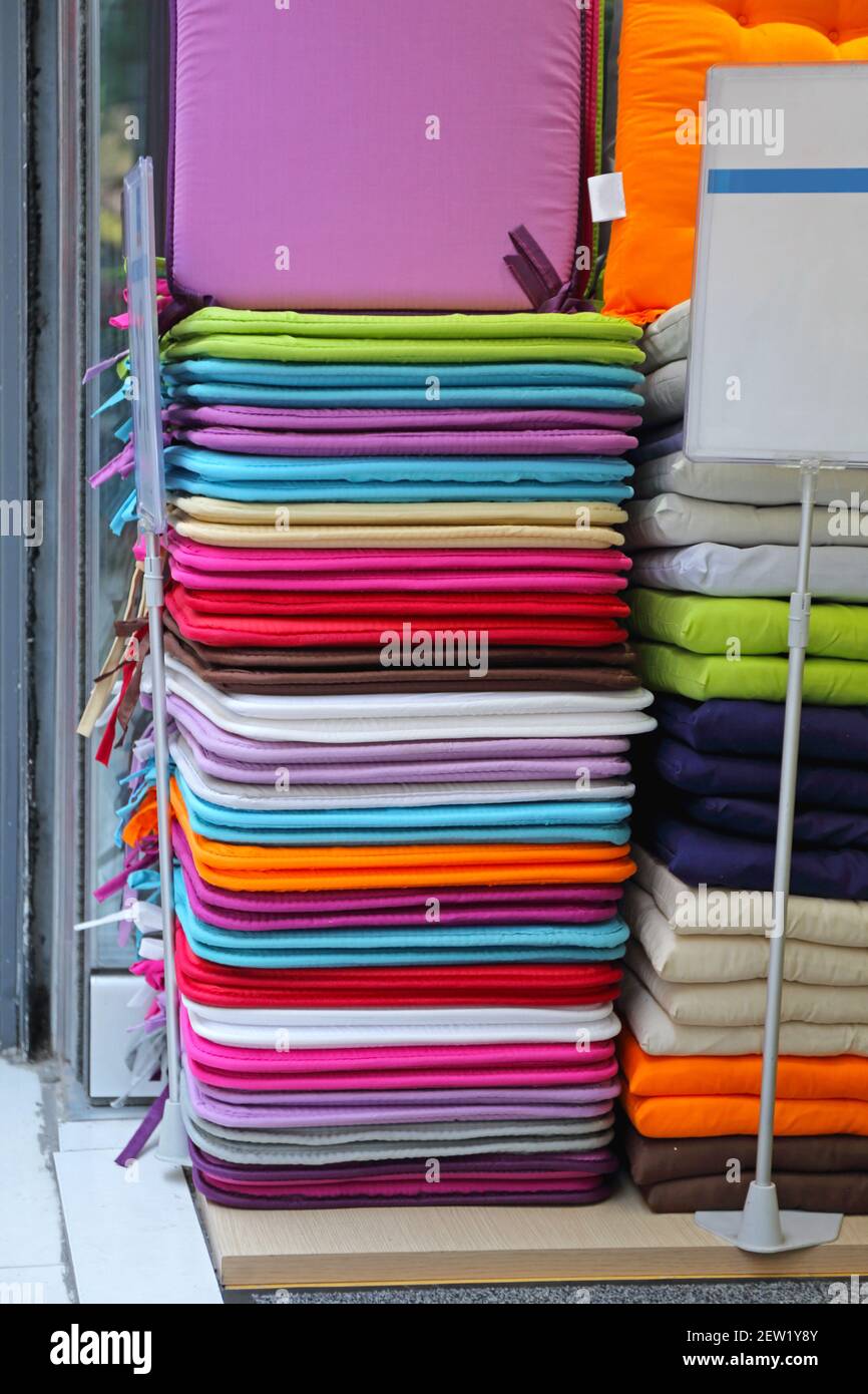 Big Stack of Colorful Chair Cushions Stock Photo - Alamy