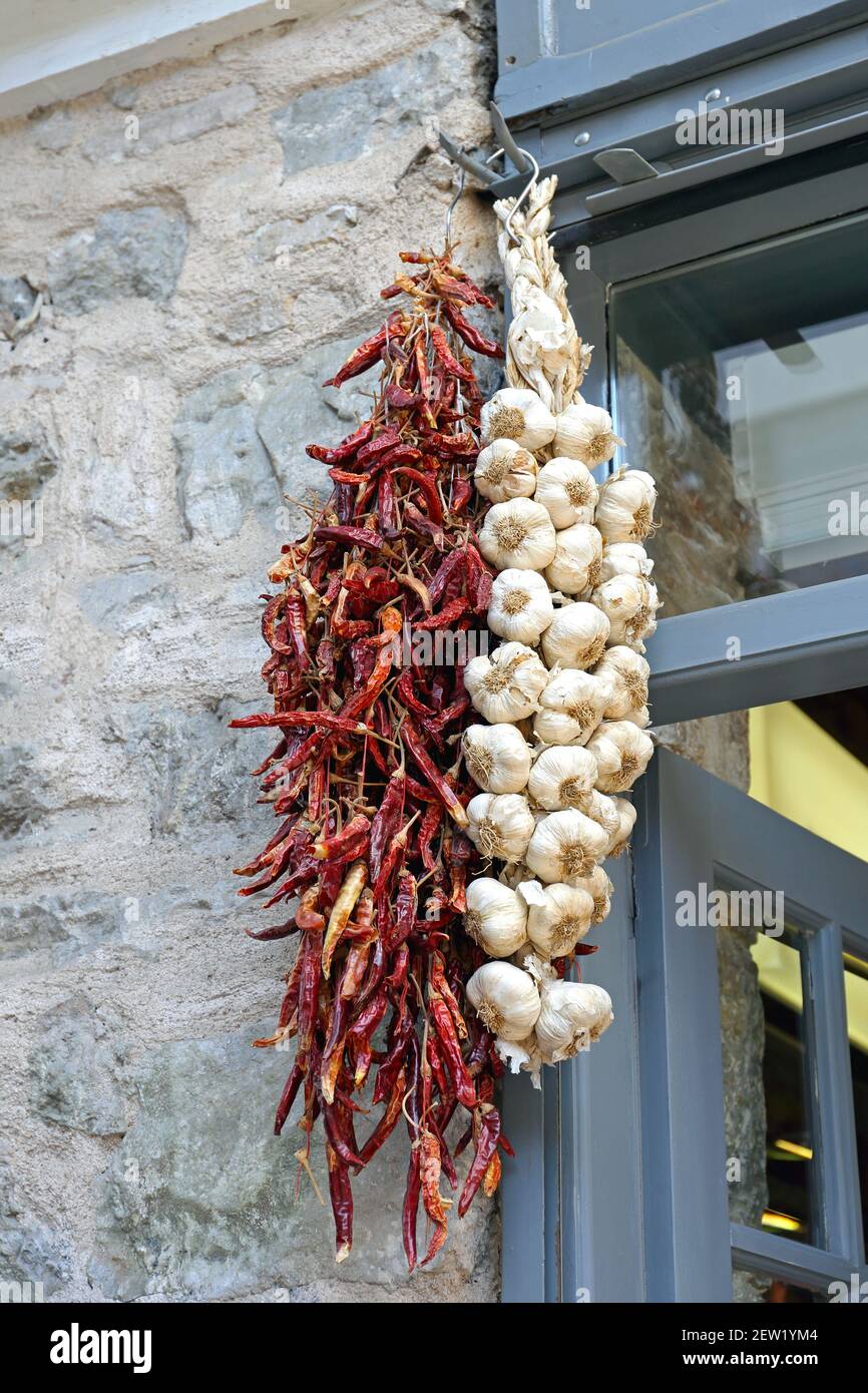 Red peppers garlic dried hanging hi-res stock photography and images ...