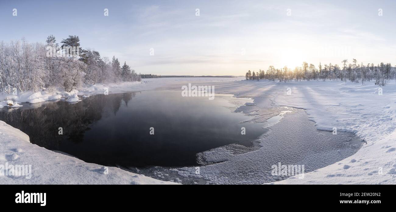 Finlande, Lapland, Kittila, snowy landscape and frozen river (aerial ...