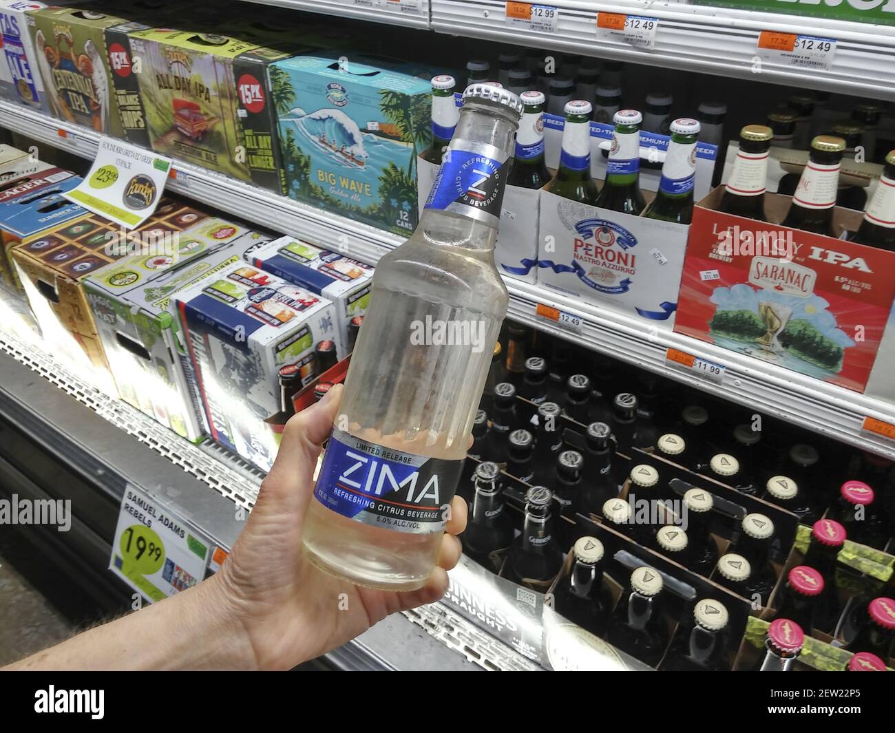A discerning consumer chooses a bottle of Zima alcoholic malt beverage ...