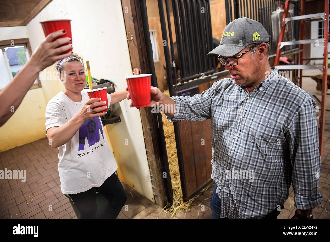 Scott Rake makes a toast with champagne with his wife Angie, out of ...