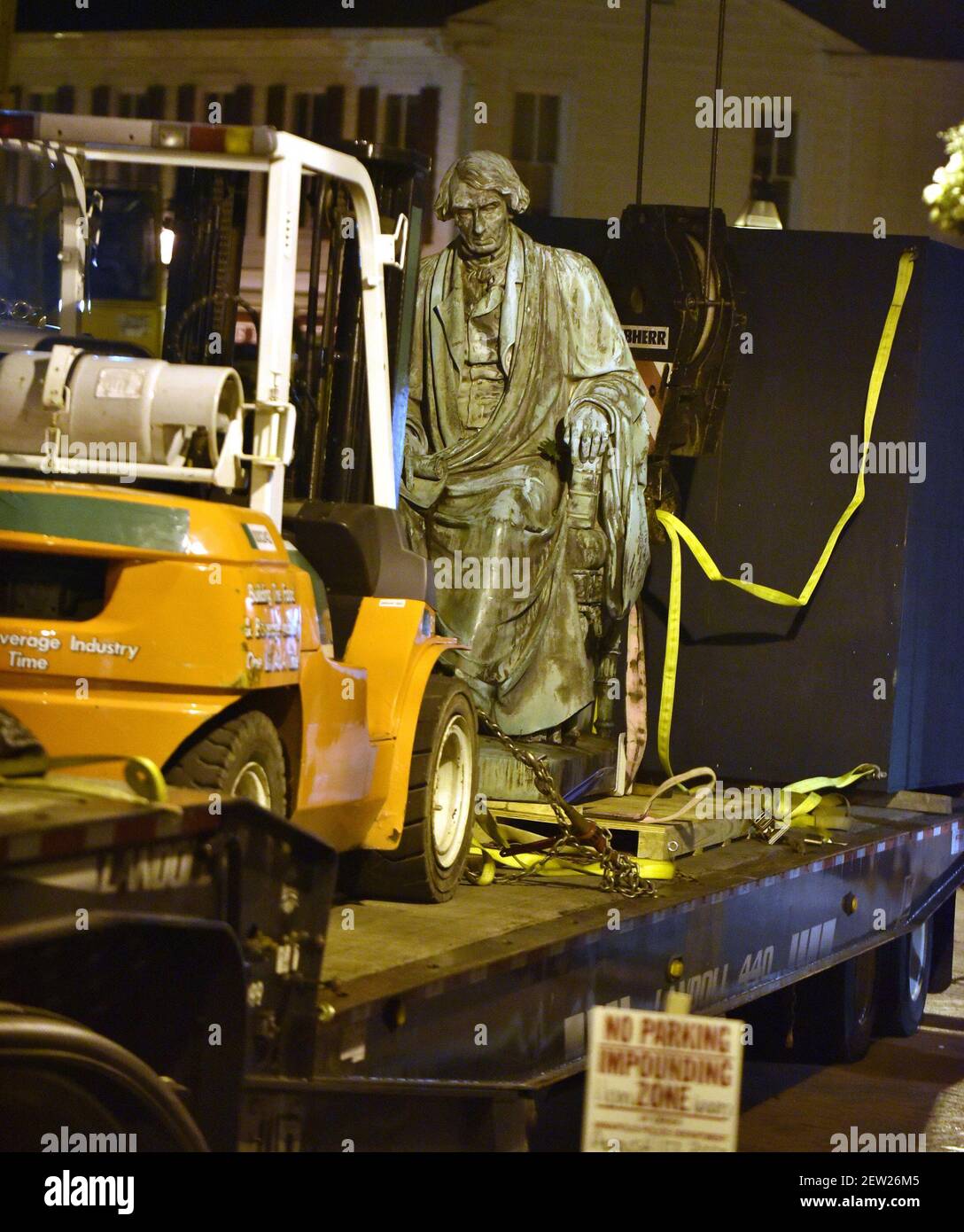 The statue rests on the back of a tractor-trailer. Crews worked to ...