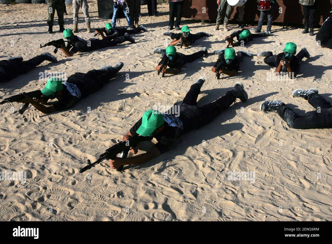 Young Palestinians in action during a military graduation ceremony at a ...