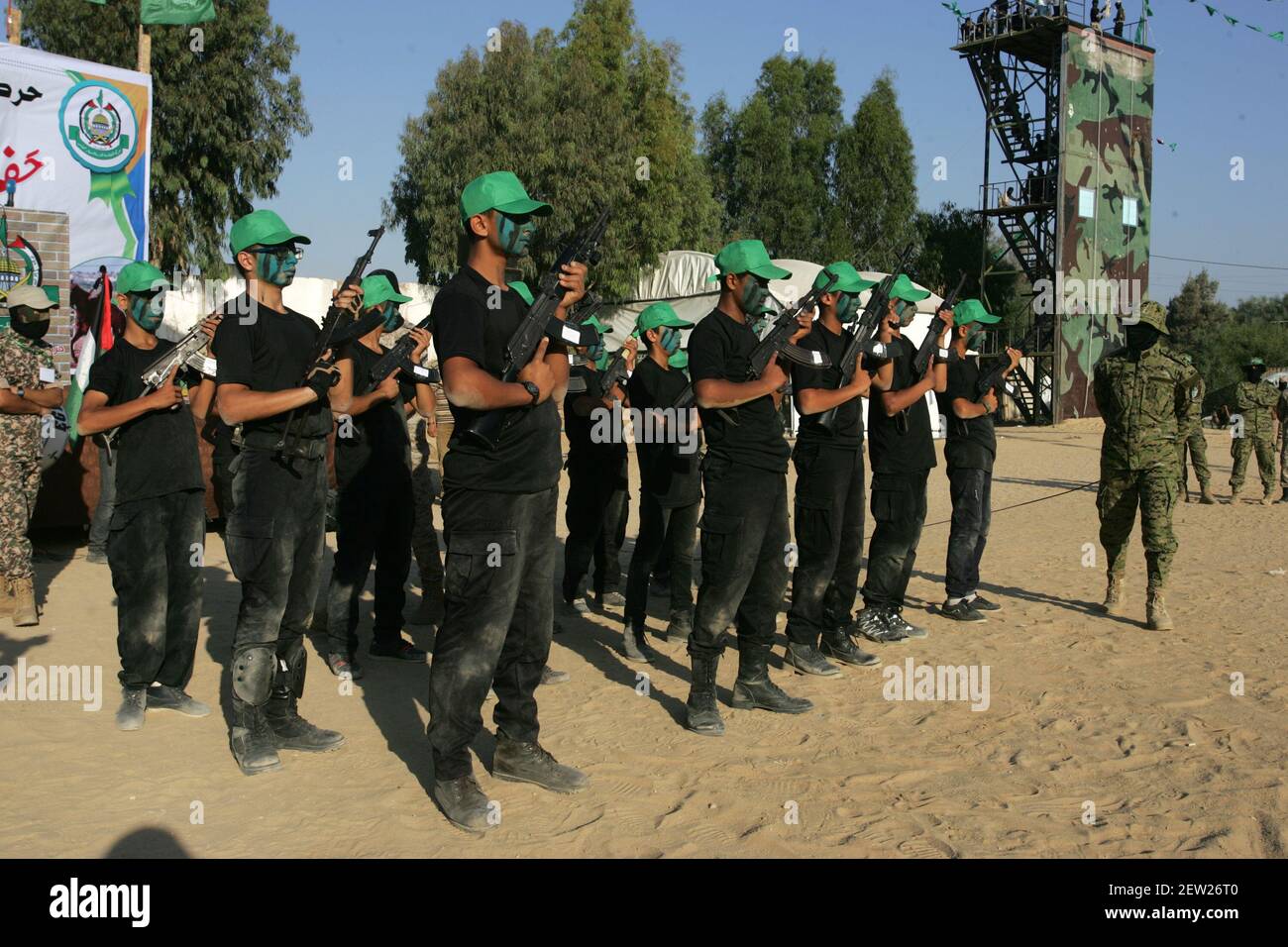 Young Palestinians in action during a military graduation ceremony at a ...