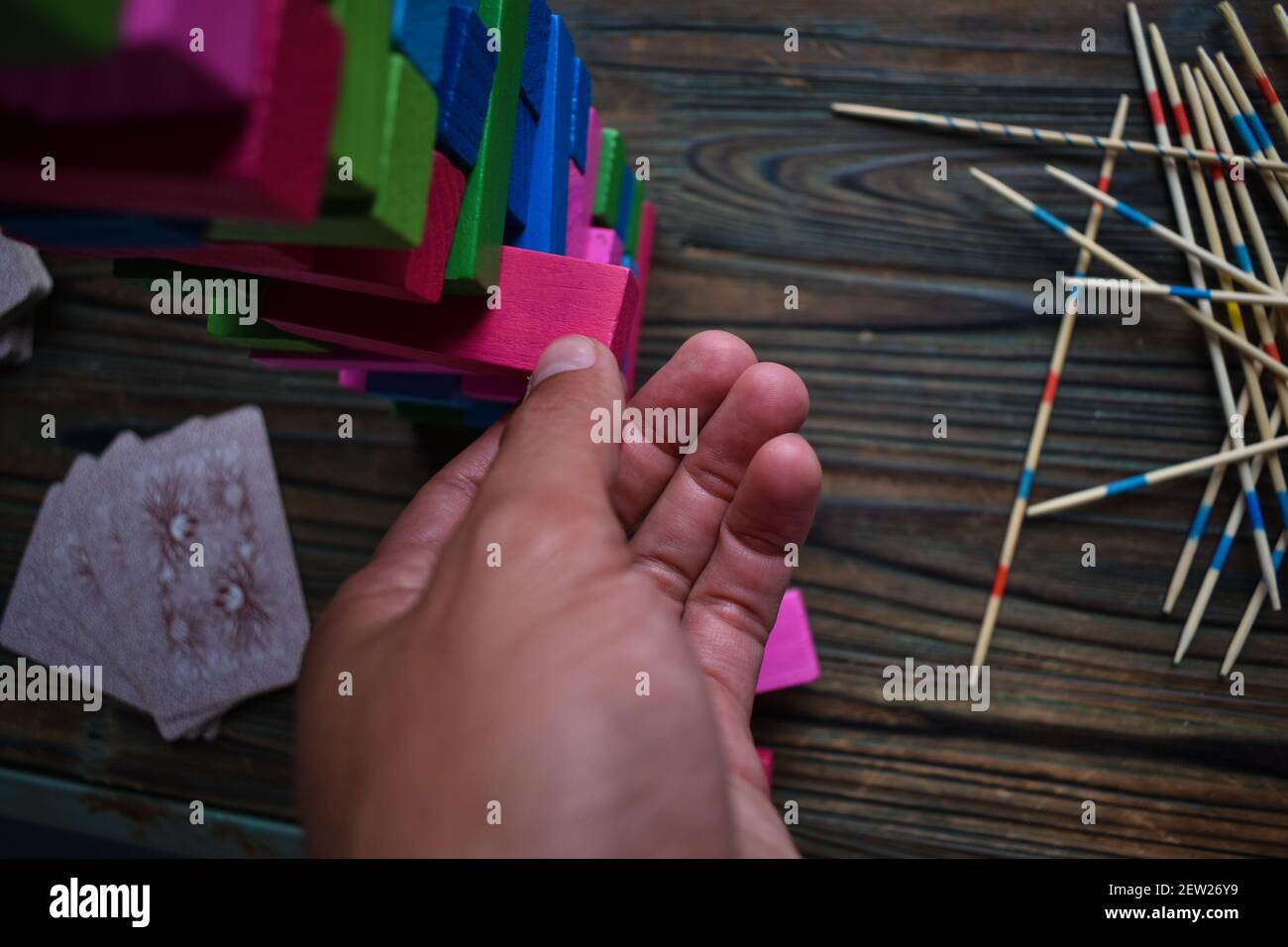 A top view of a person playing a mikado game Stock Photo - Alamy