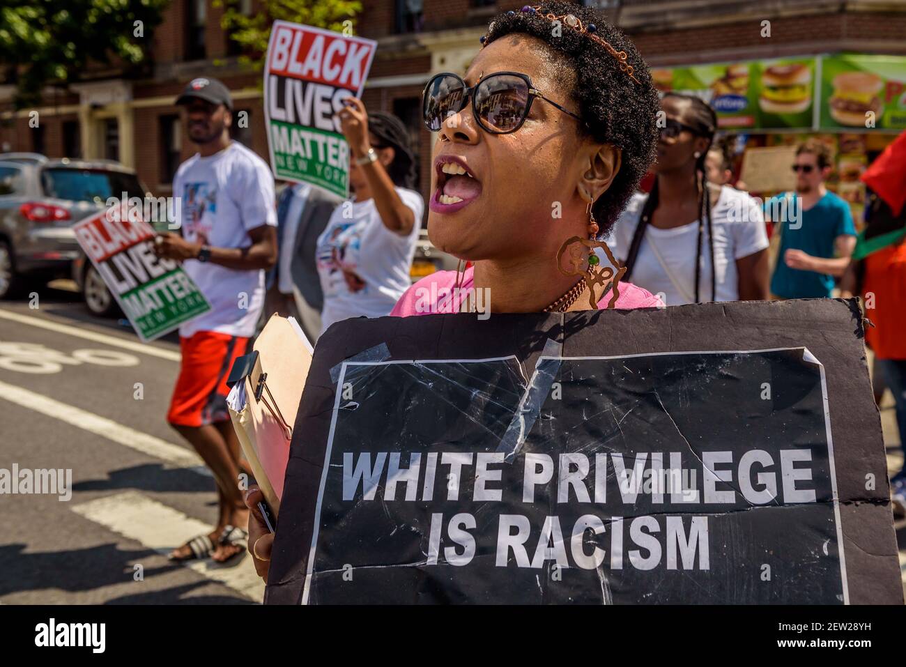 Over one hundred people gathered in front of the home of recent NYPD ...