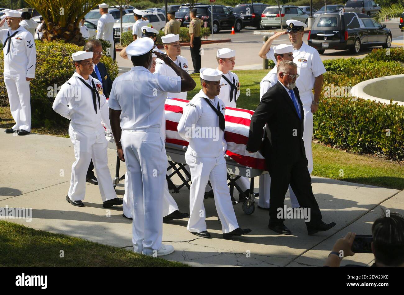 The casket containing the body of Navy Fire Controlman 2nd Class Carlos ...