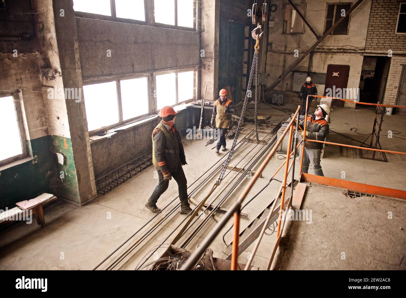 Ukrainian workers at the factory of reinforced concrete products ...