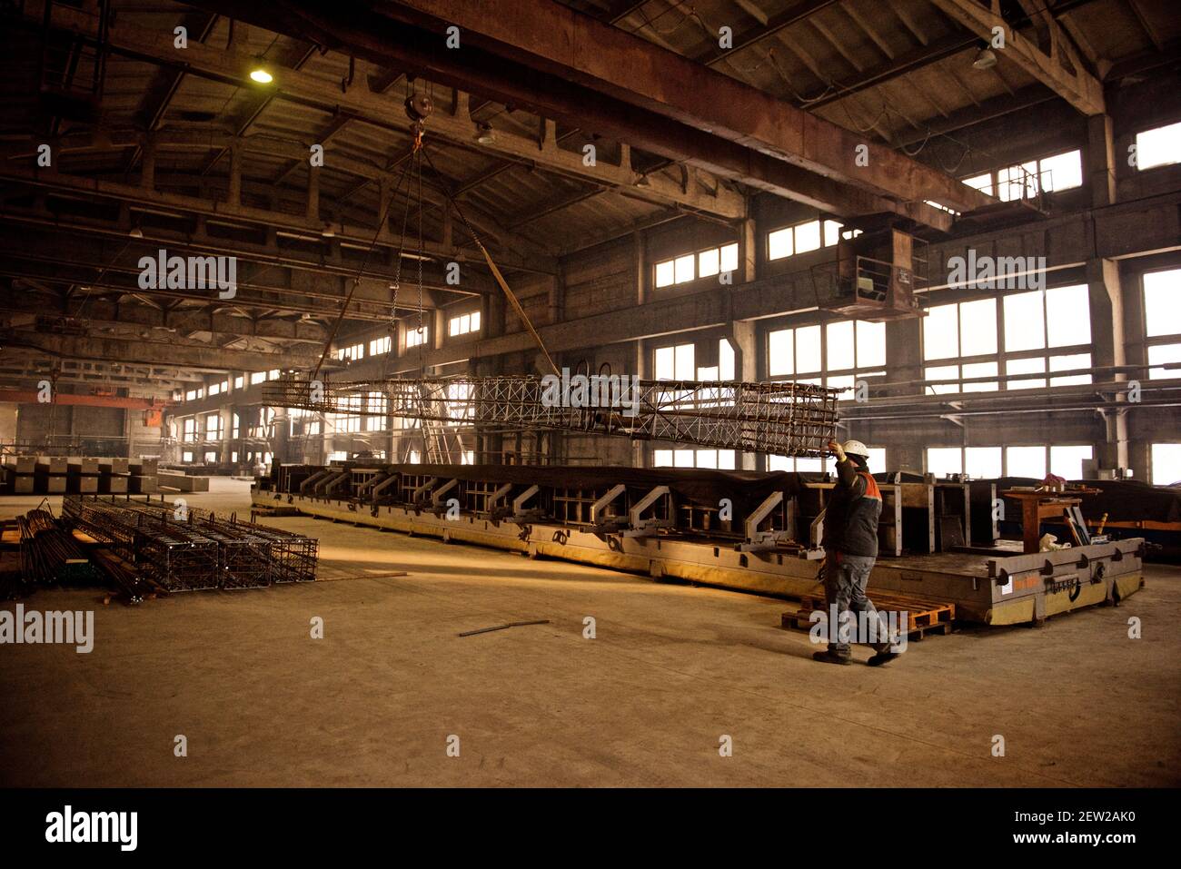 Ukrainian workers at the factory of reinforced concrete products ...