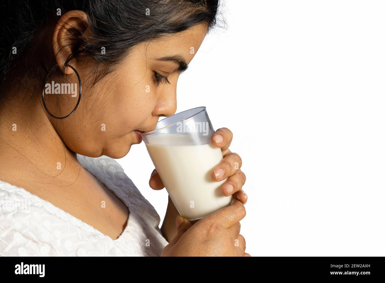 Indian girl drinking glass milk hi-res stock photography and images - Alamy